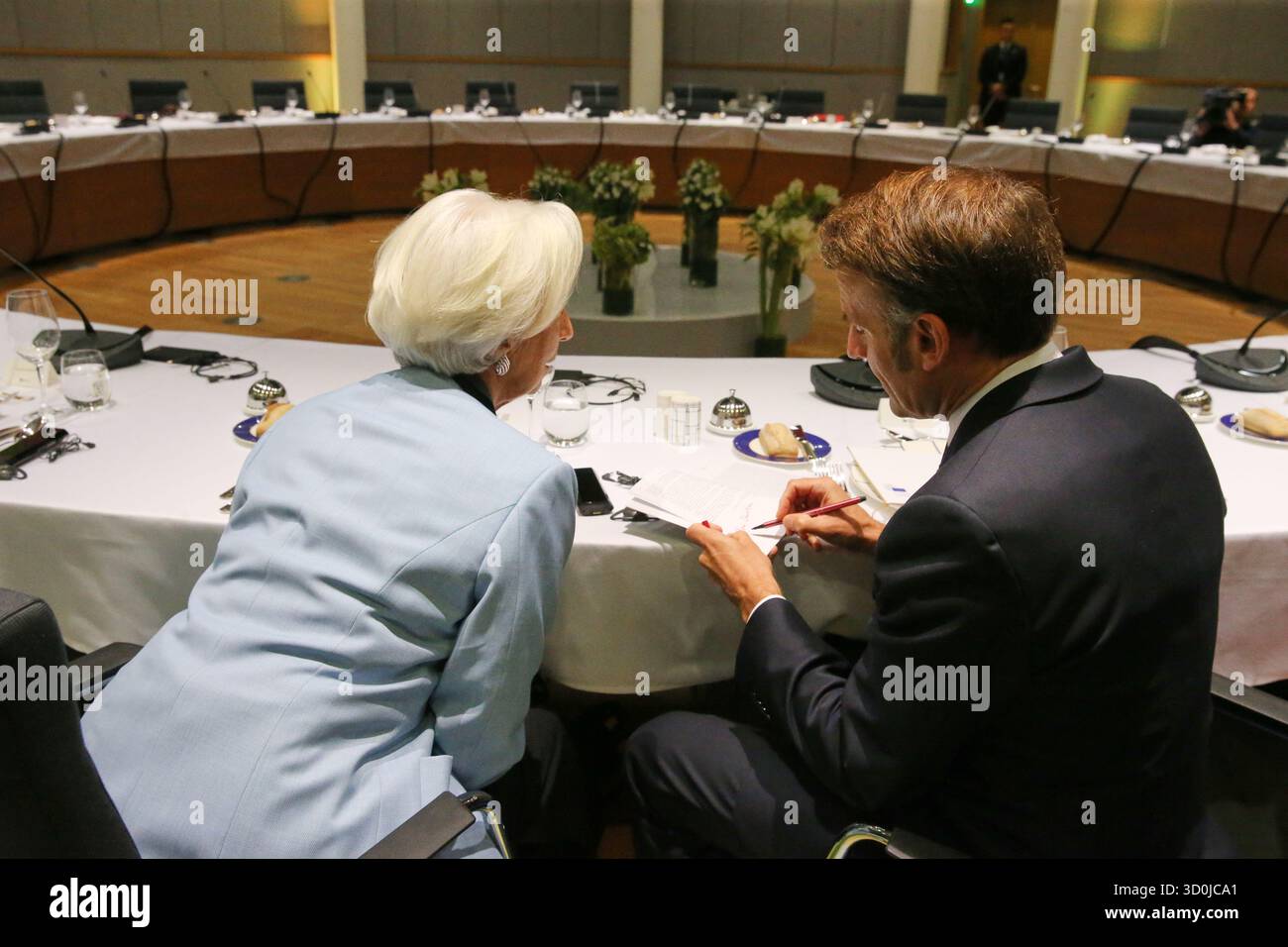 European Central Bank President Christine Lagarde, left, speaks with ...