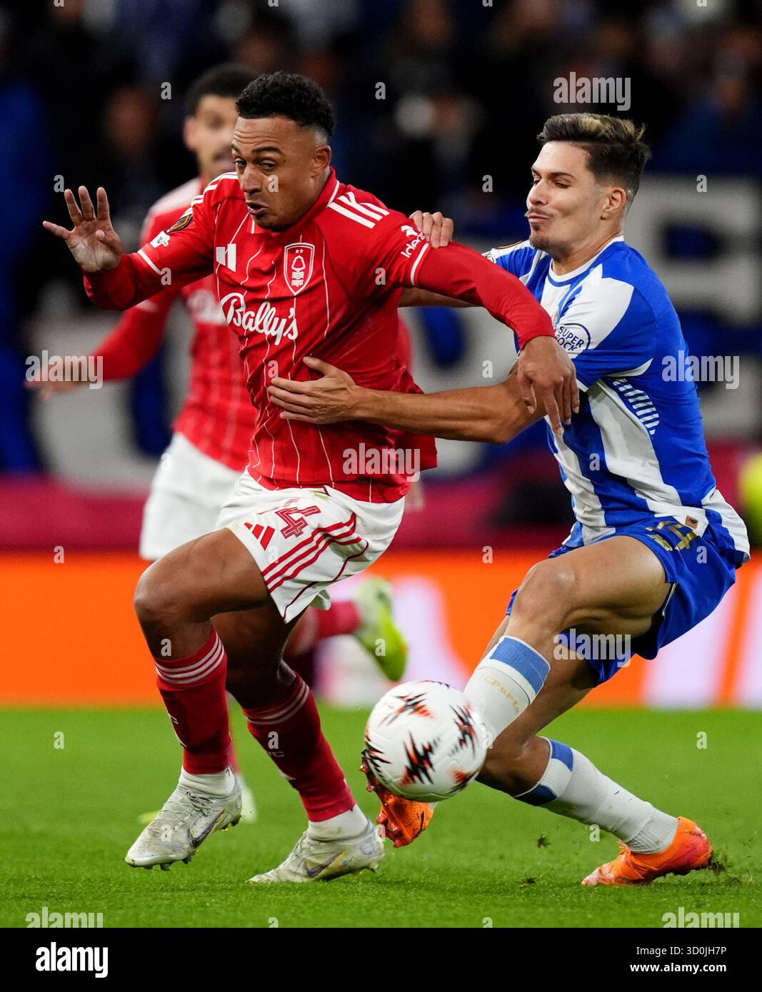 Nottingham Forest's Dan Ndoye (left) and Porto's Francisco Moura battle ...