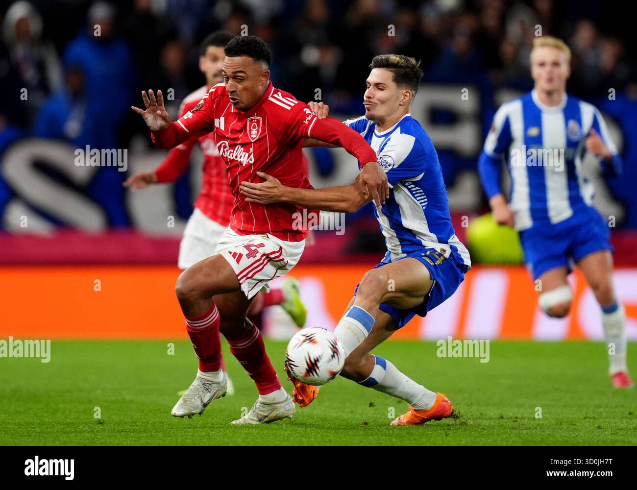 Nottingham Forest's Dan Ndoye (left) and Porto's Francisco Moura battle ...