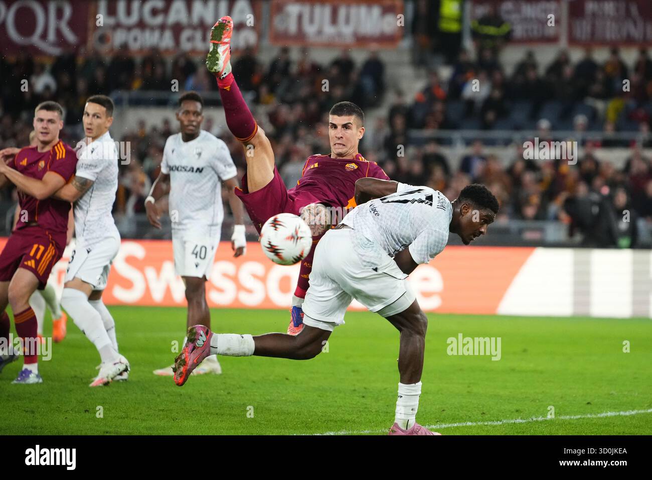 Roma's Gianluca Mancini vies for the ball with Plzen's Rafiu Durosinmi ...