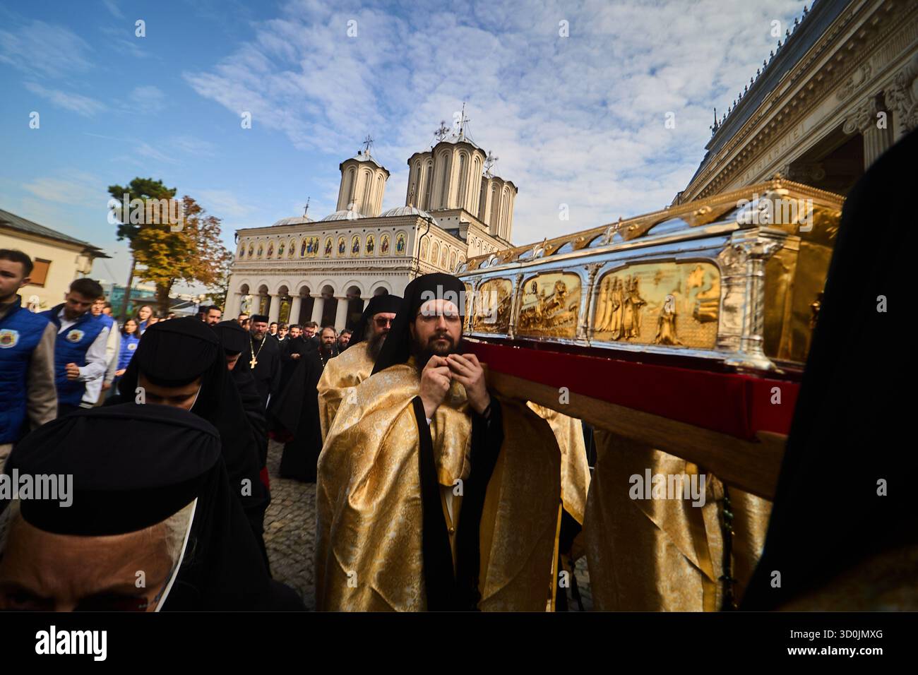 Bucharest, Romania. 23rd Oct, 2025: Orthodox priests carry the relics ...