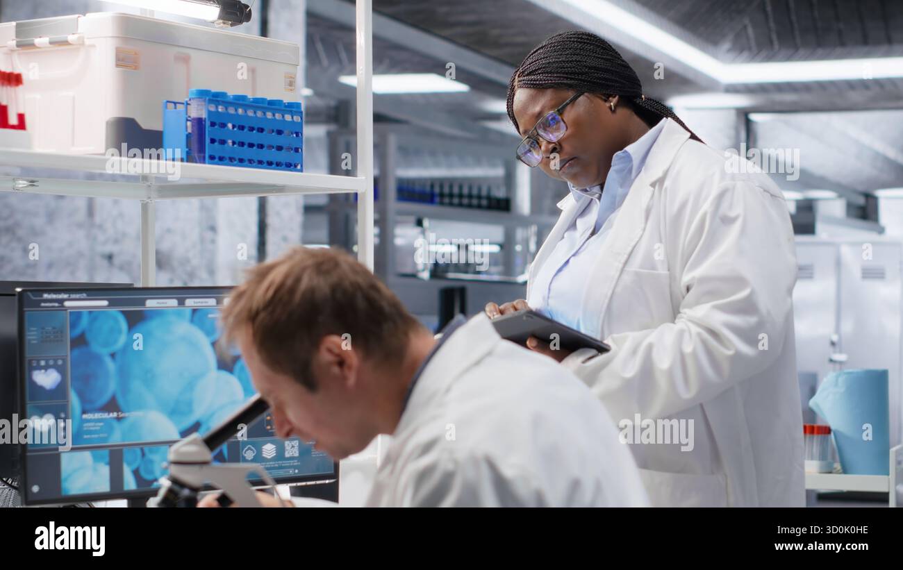 Employees team studying sample hi-res stock photography and images - Alamy