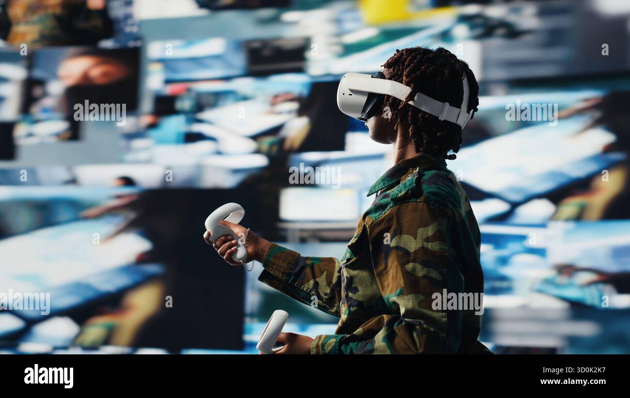 Soldier providing combat support, looking at reconnaissance feeds using ...