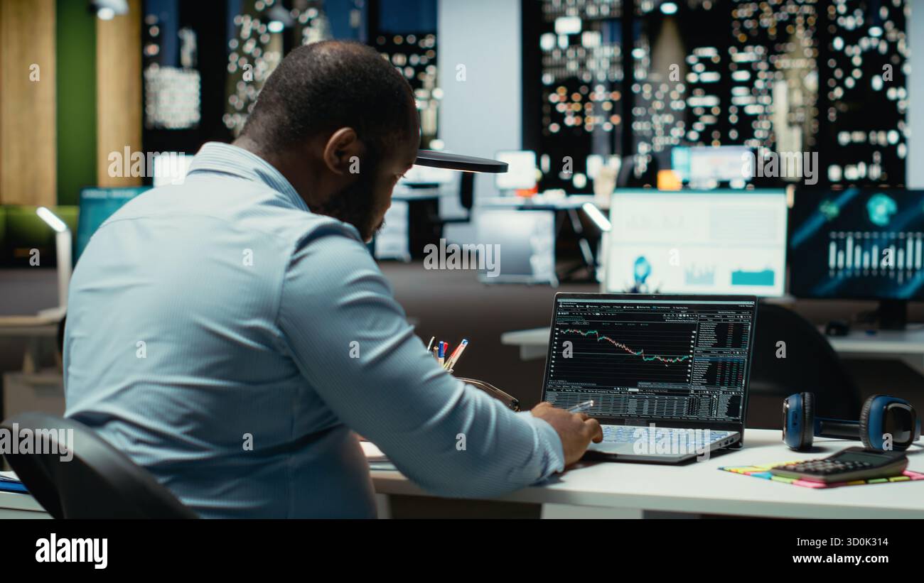 Angry concerned black man losing money with forex trend going down ...
