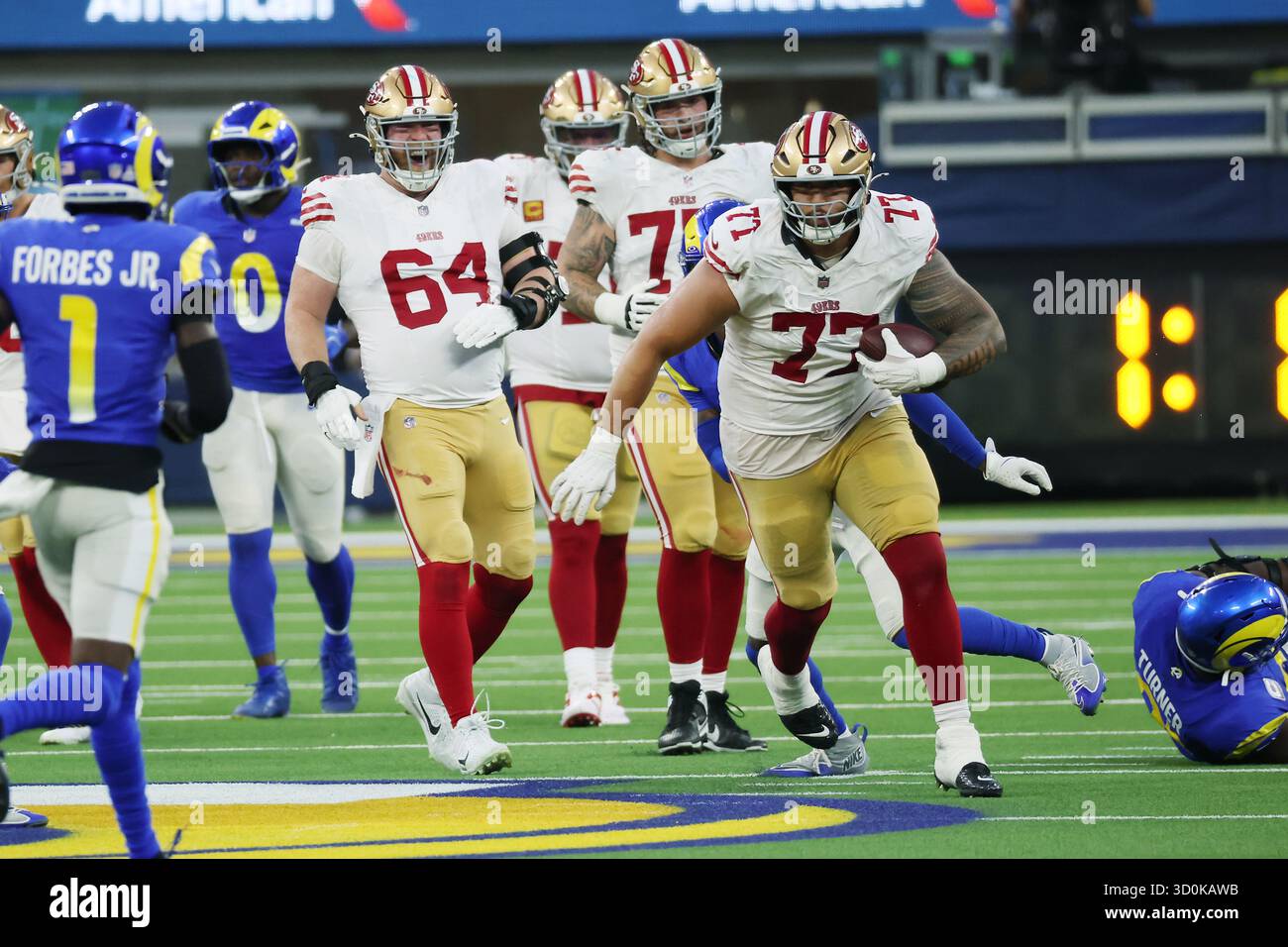 San Francisco 49ers guard Dominick Puni (77) runs the ball during an ...
