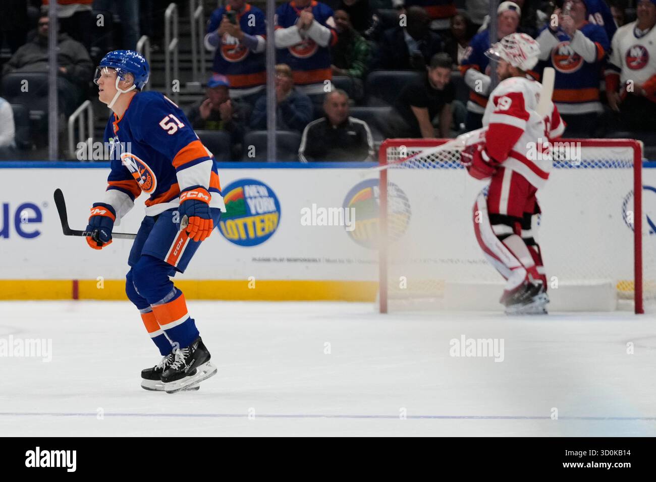New York Islanders' Emil Heinema, left, passes Detroit Red Wings ...