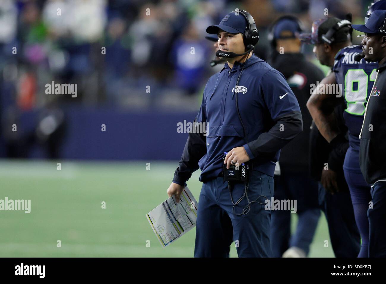 Seattle Seahawks head coach Mike Macdonald watches from the sideline ...