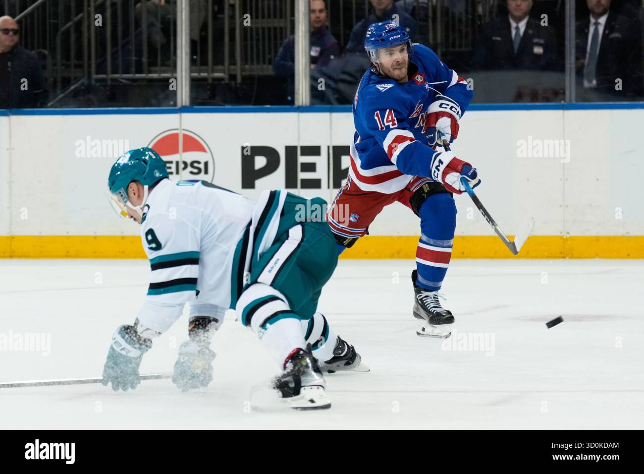 New York Rangers' Taylor Raddysh, right, scores past San Jose Sharks ...
