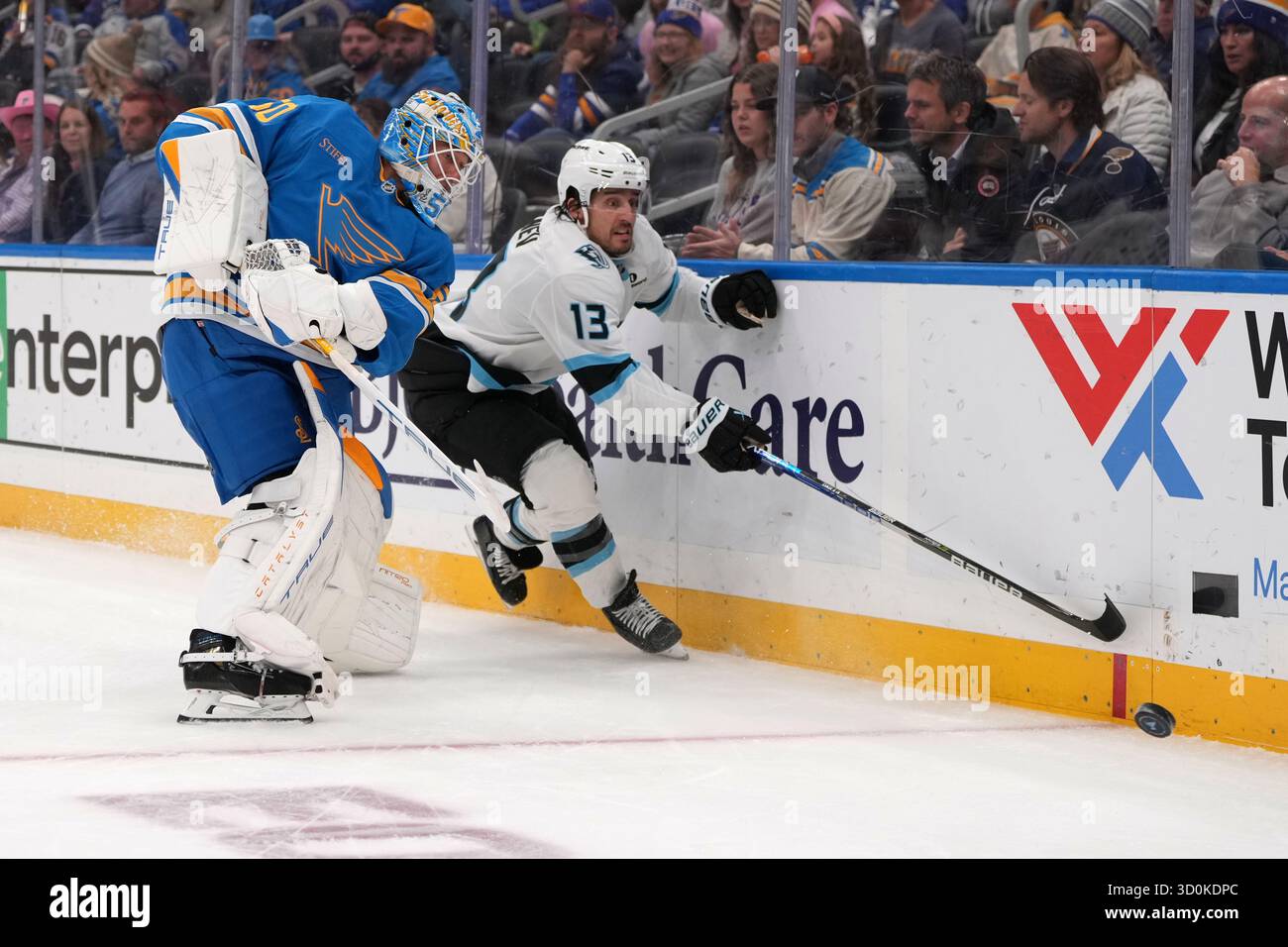 St. Louis Blues goaltender Jordan Binnington (50) clears the puck away ...