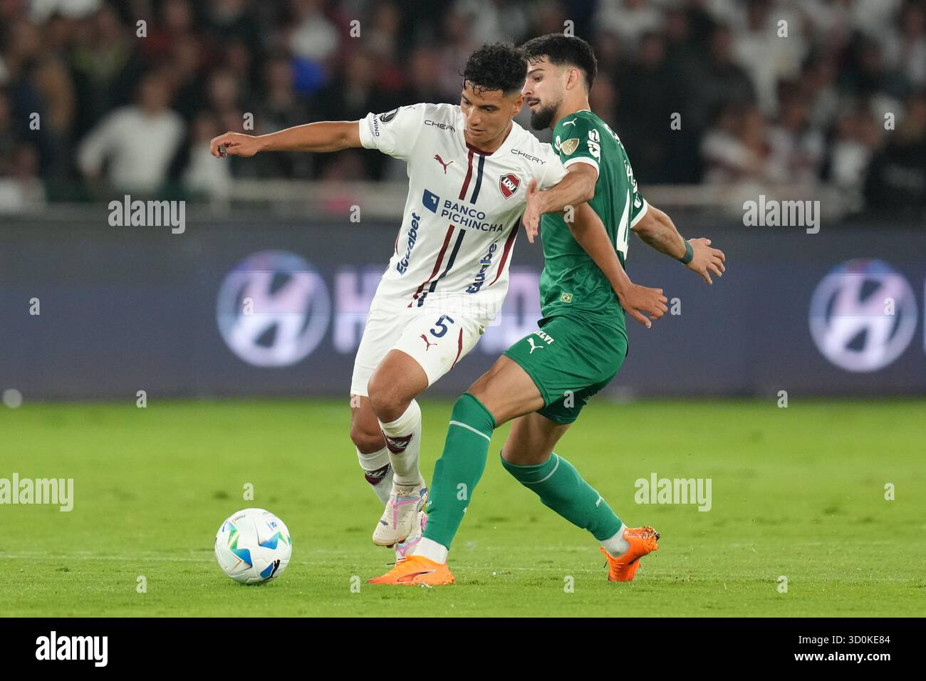 Jose Manuel Lopez of Brazil's Palmeiras, right, challenges Kevin Minda ...