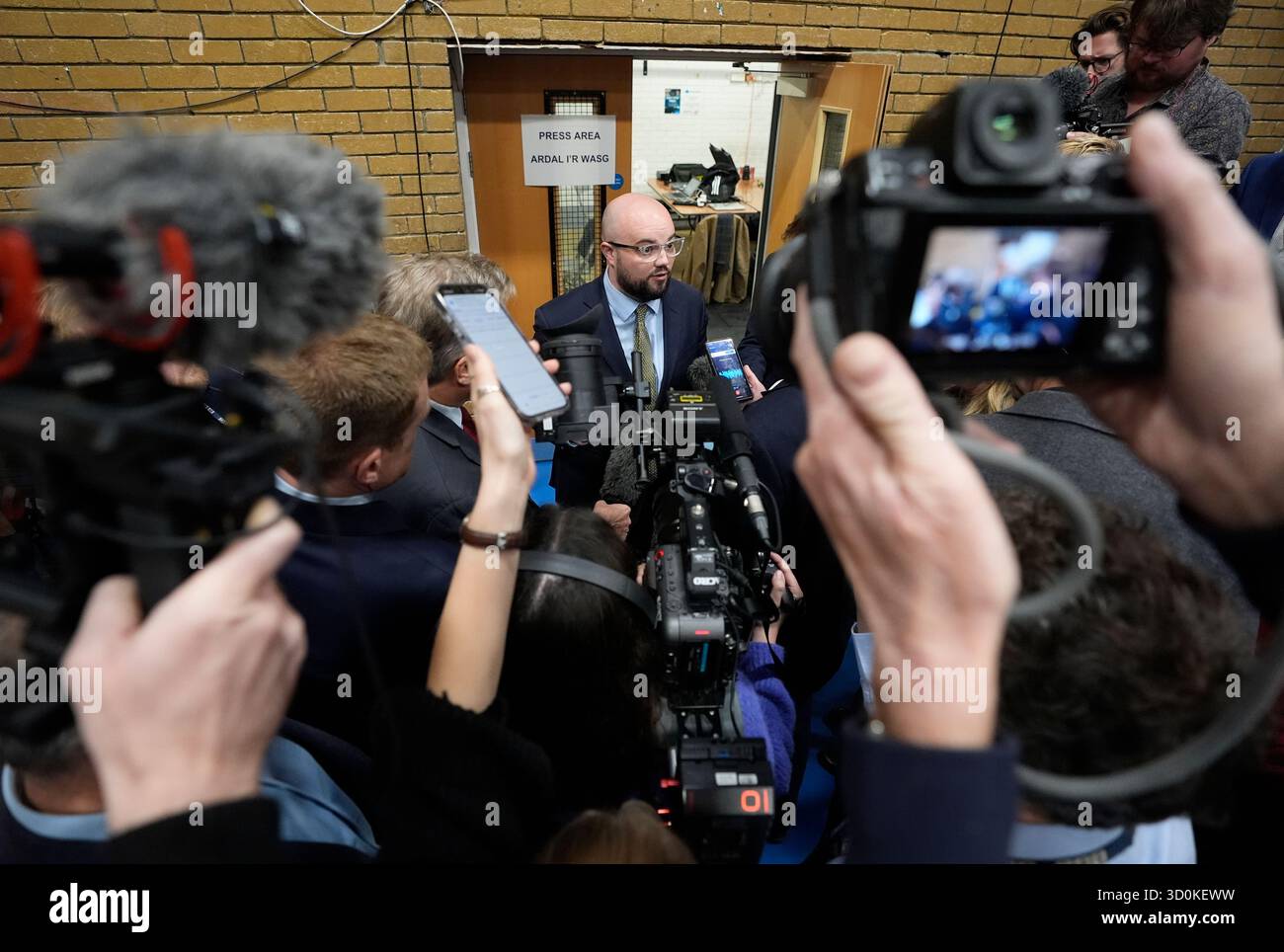 Reform UK's Llyr Powell is interviewed by the media following the ...