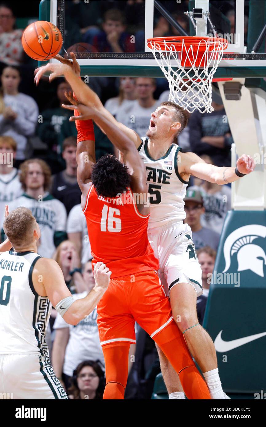 Michigan State center Carson Cooper, right, blocks a shot by Bowling ...