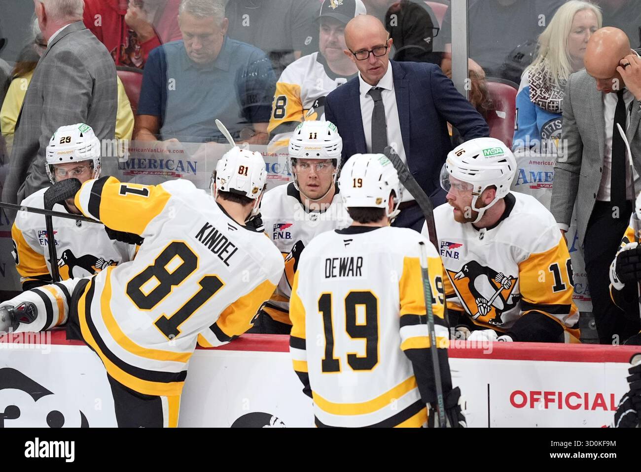 Pittsburgh Penguins head coach Dan Muse, back center, talks to his ...