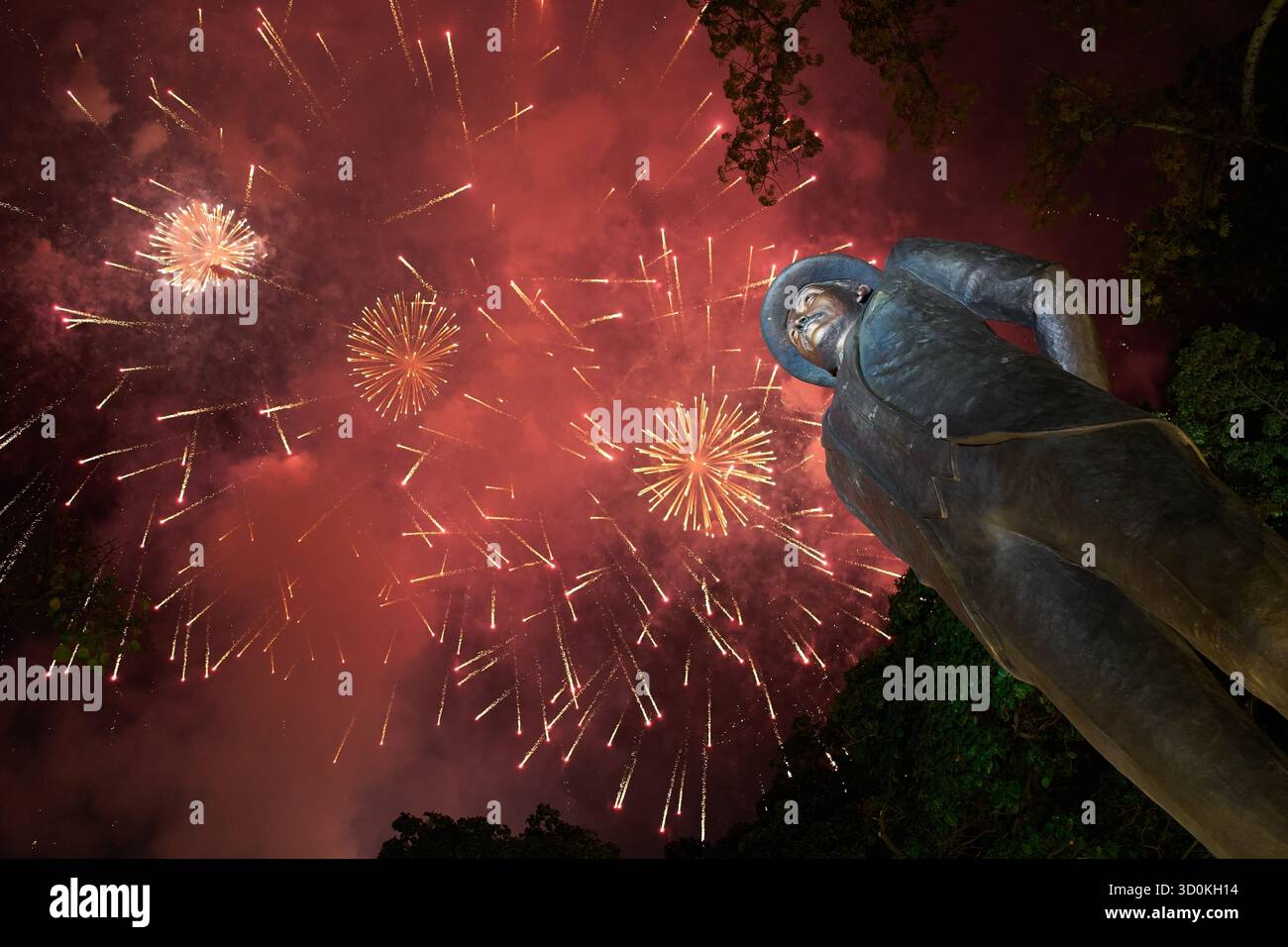 FILE - Fireworks explode above a statue of Jose Gregorio Hernandez who ...