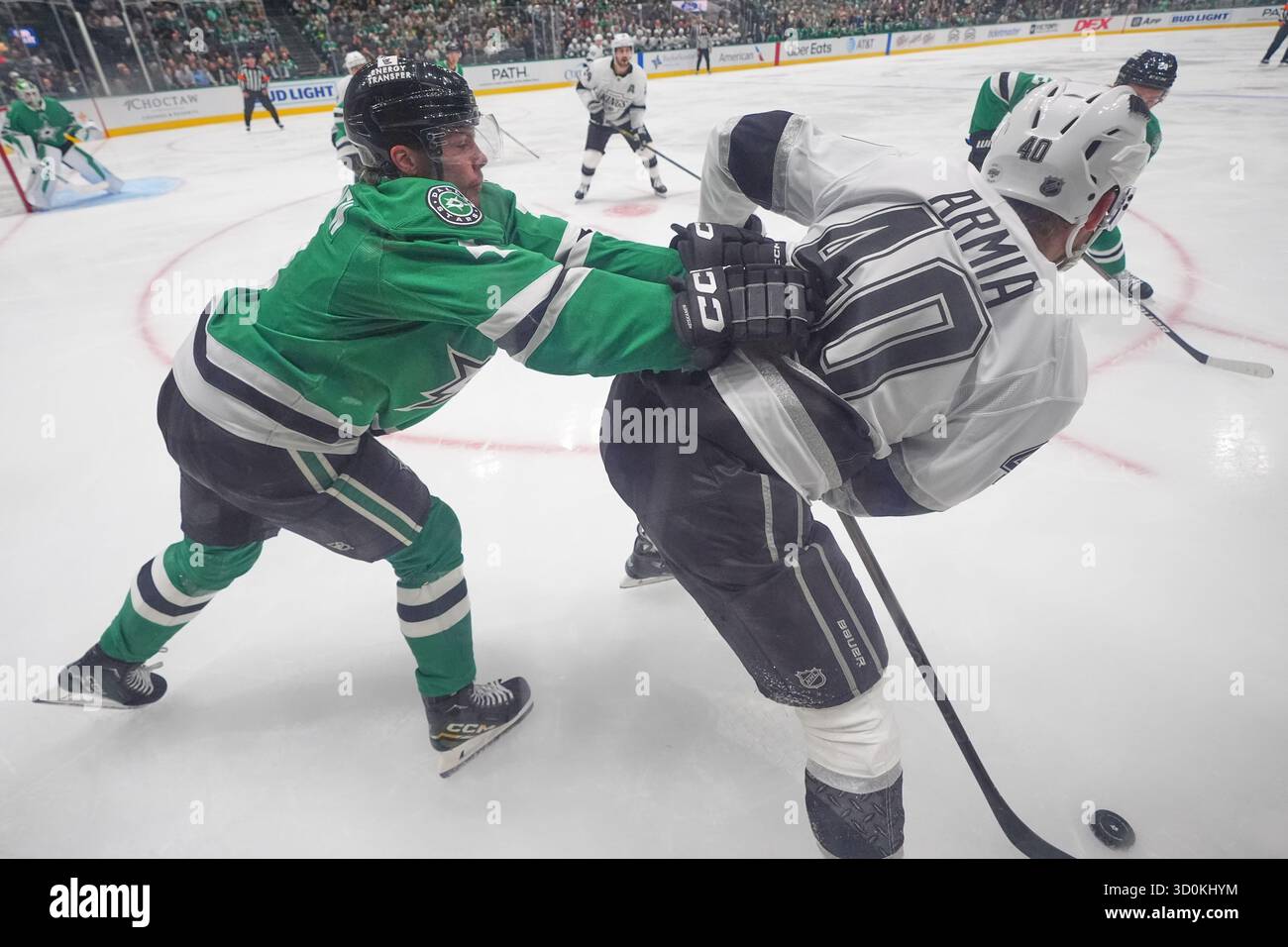 Dallas Stars defenseman Miro Heiskanen, left, pushes Los Angeles Kings ...