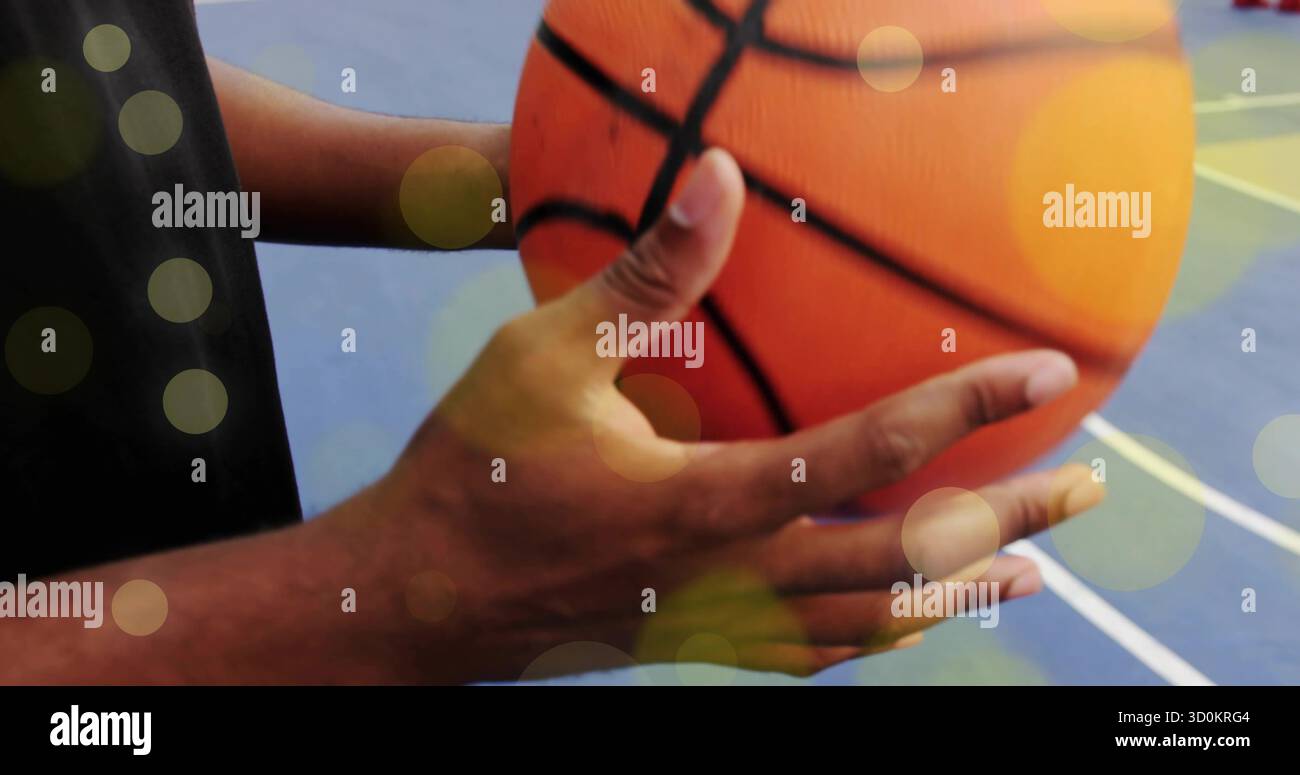 Gripping male athlete showing forearms and hands on blue gym court ...
