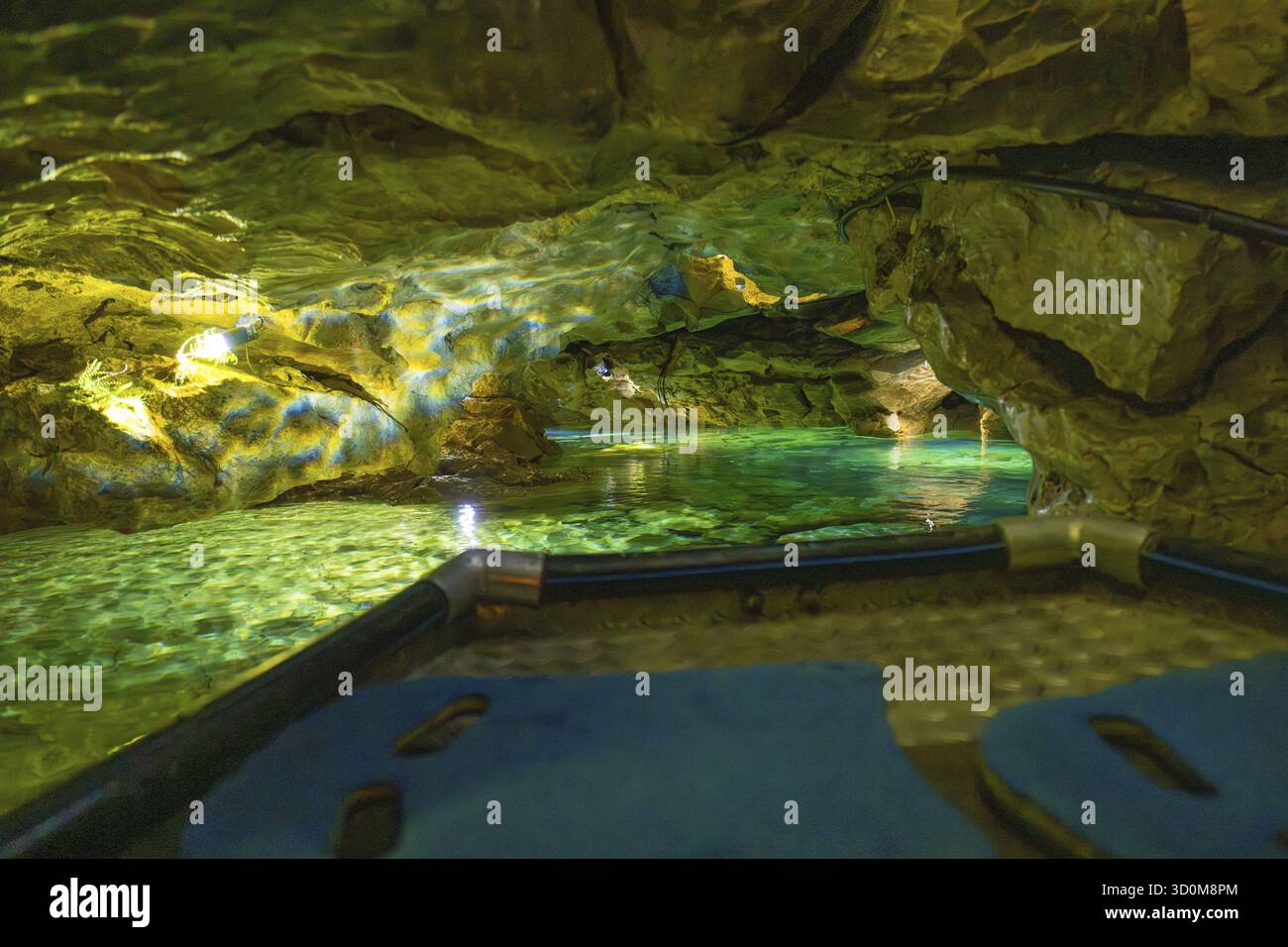View from a boat of the impressively illuminated interior of a cave ...