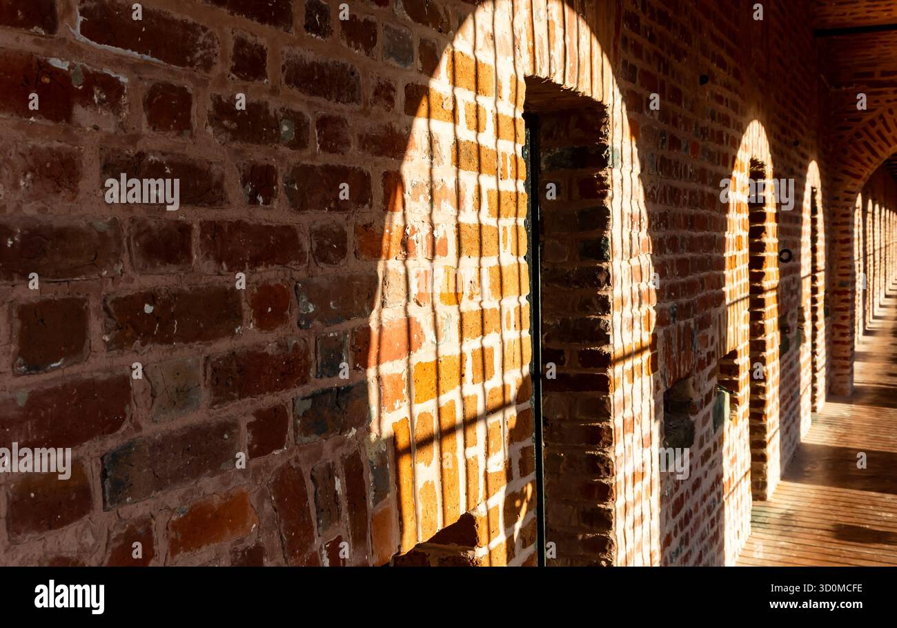 cellular jail prisoner cell hallway in natural sunlight image is taken ...