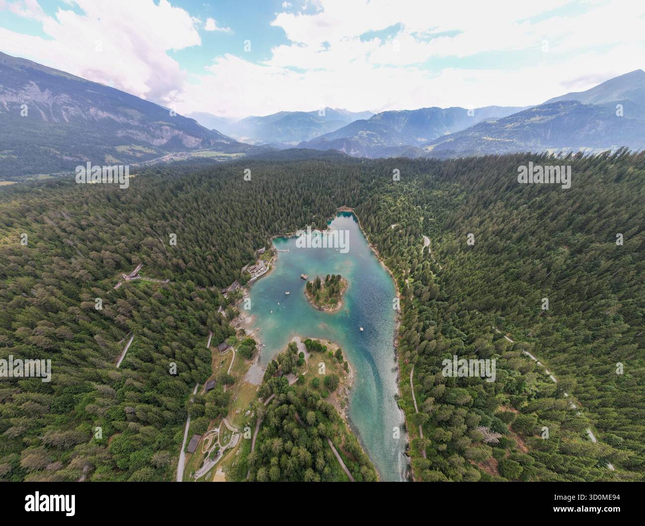 Aerial view of the turquoise waters of Lake Crestasee nestled amidst a ...
