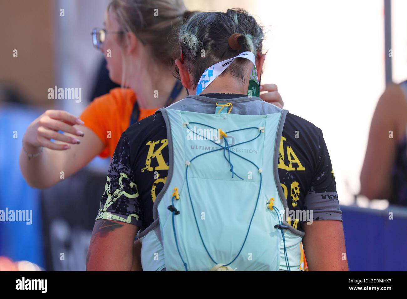 Finisher receiving a medal after completing a ultra run race Stock ...