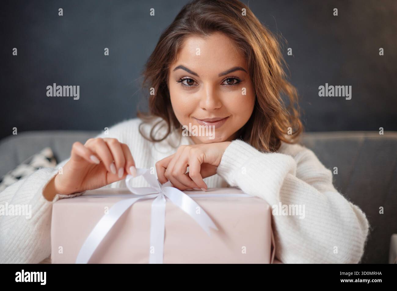 Adult woman wrapping gift box hi-res stock photography and images - Alamy
