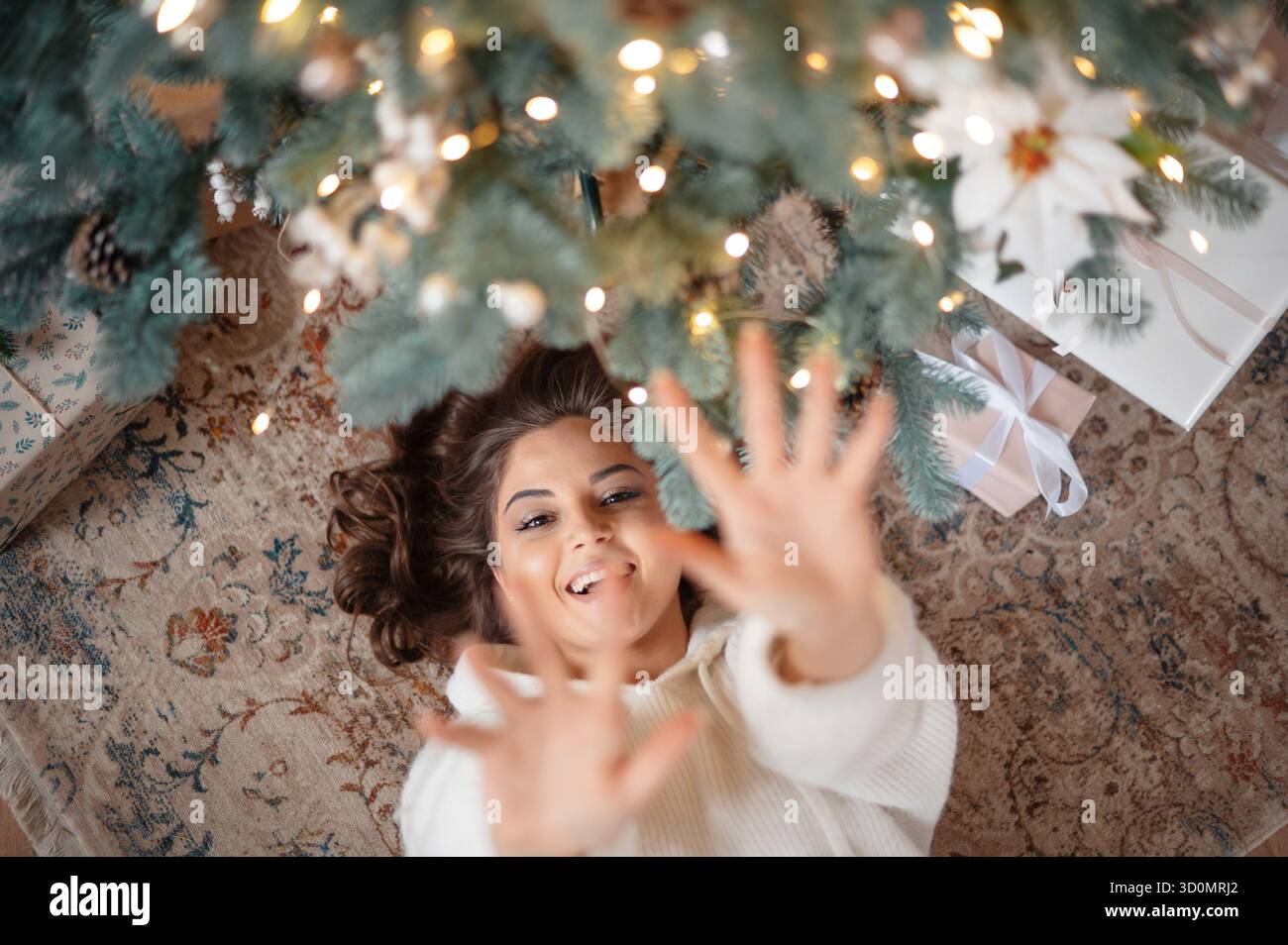 Woman reaching up under hi-res stock photography and images - Alamy