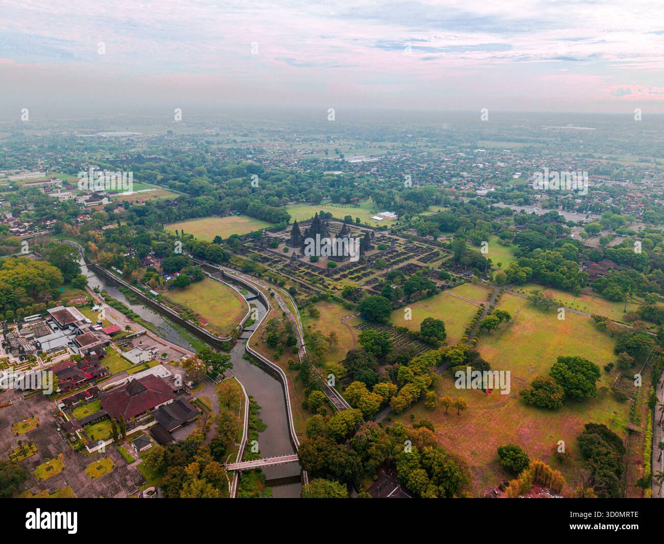 Aerial view of the majestic Prambanan Temple stands amidst lush ...