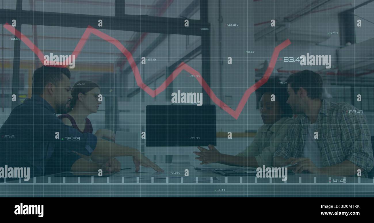Office professionals reviewing monitor in open-plan office, with ...