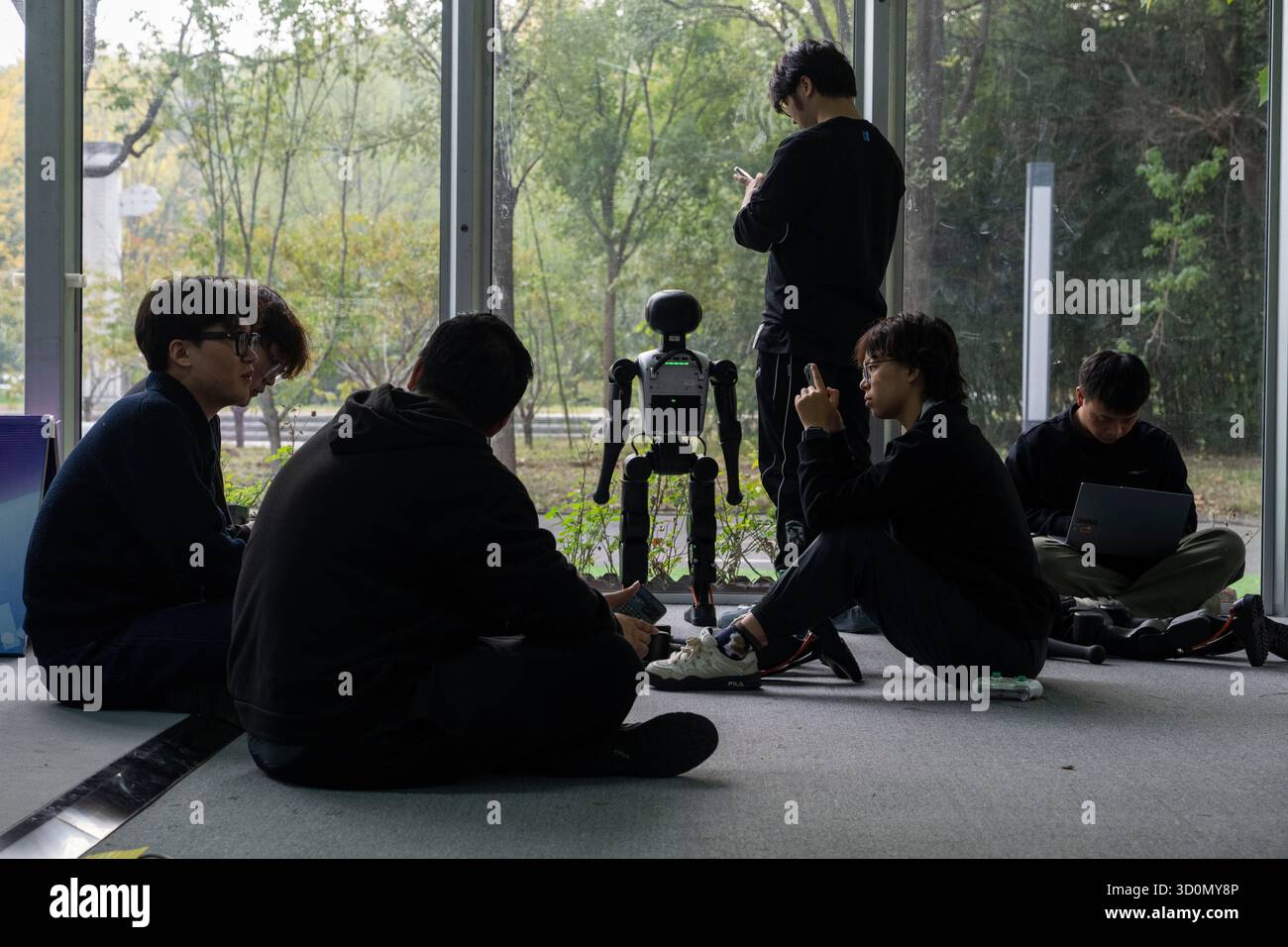 Workers prepare for a robot soccer game using the newly launched K1 ...