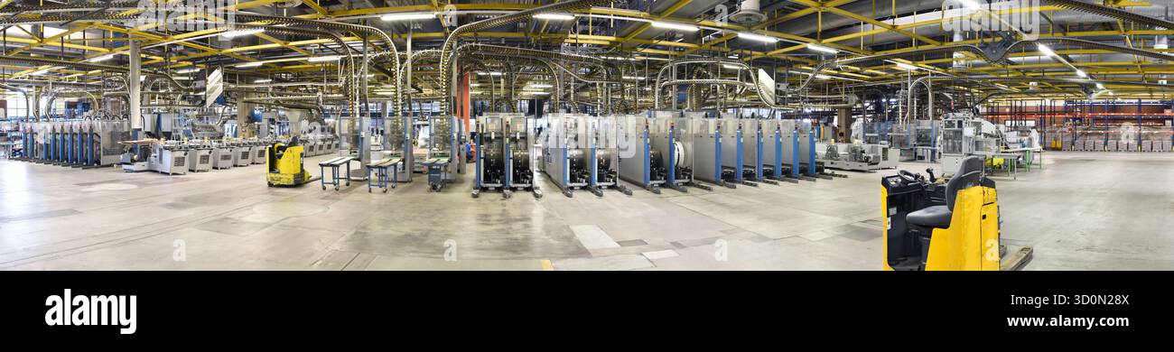 modern machines for transportation in a large print shop for production ...