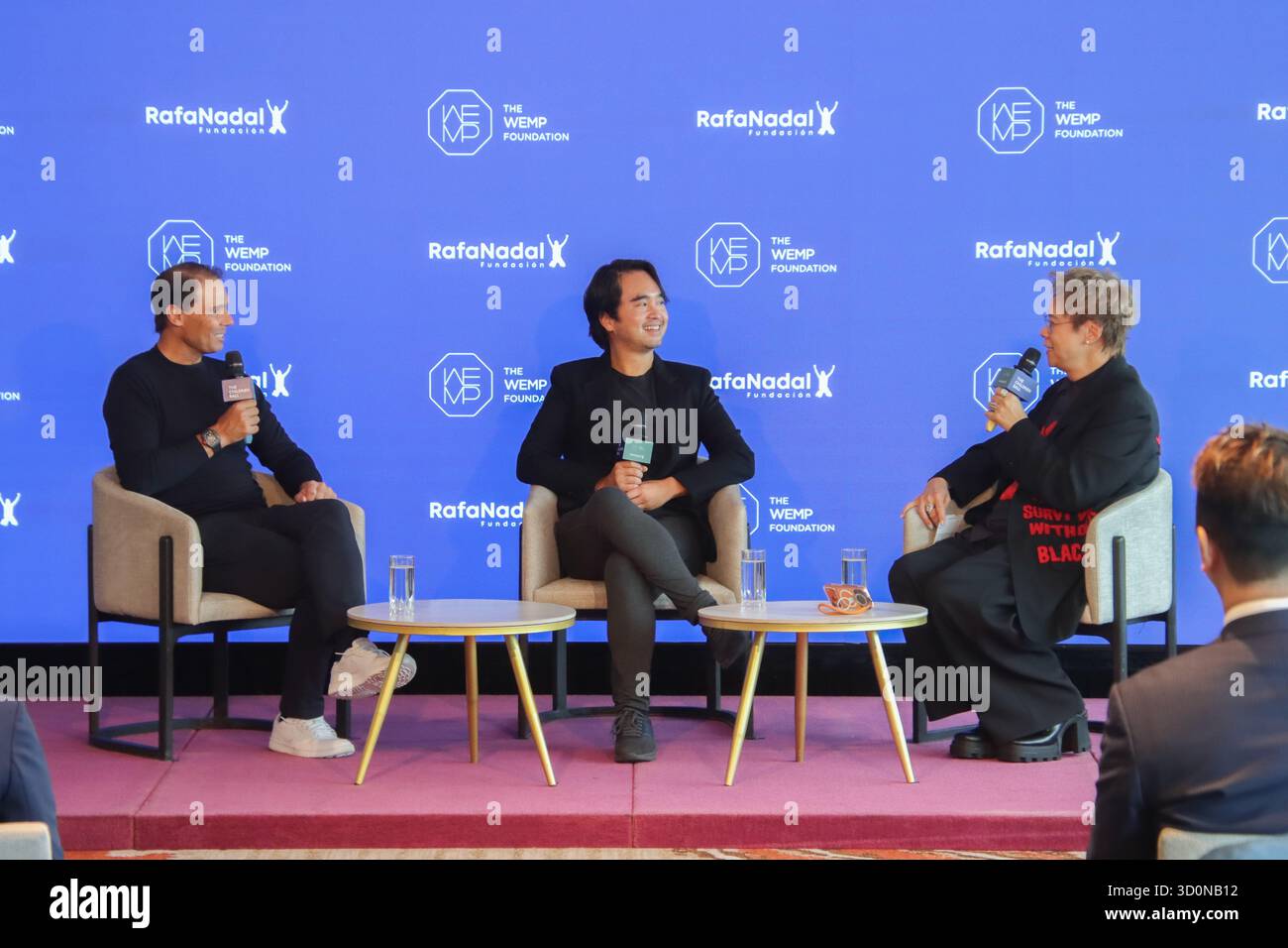 Rafael Nadal (L), founder of Fundacion Rafa Nadal and Adrian Cheung (R ...