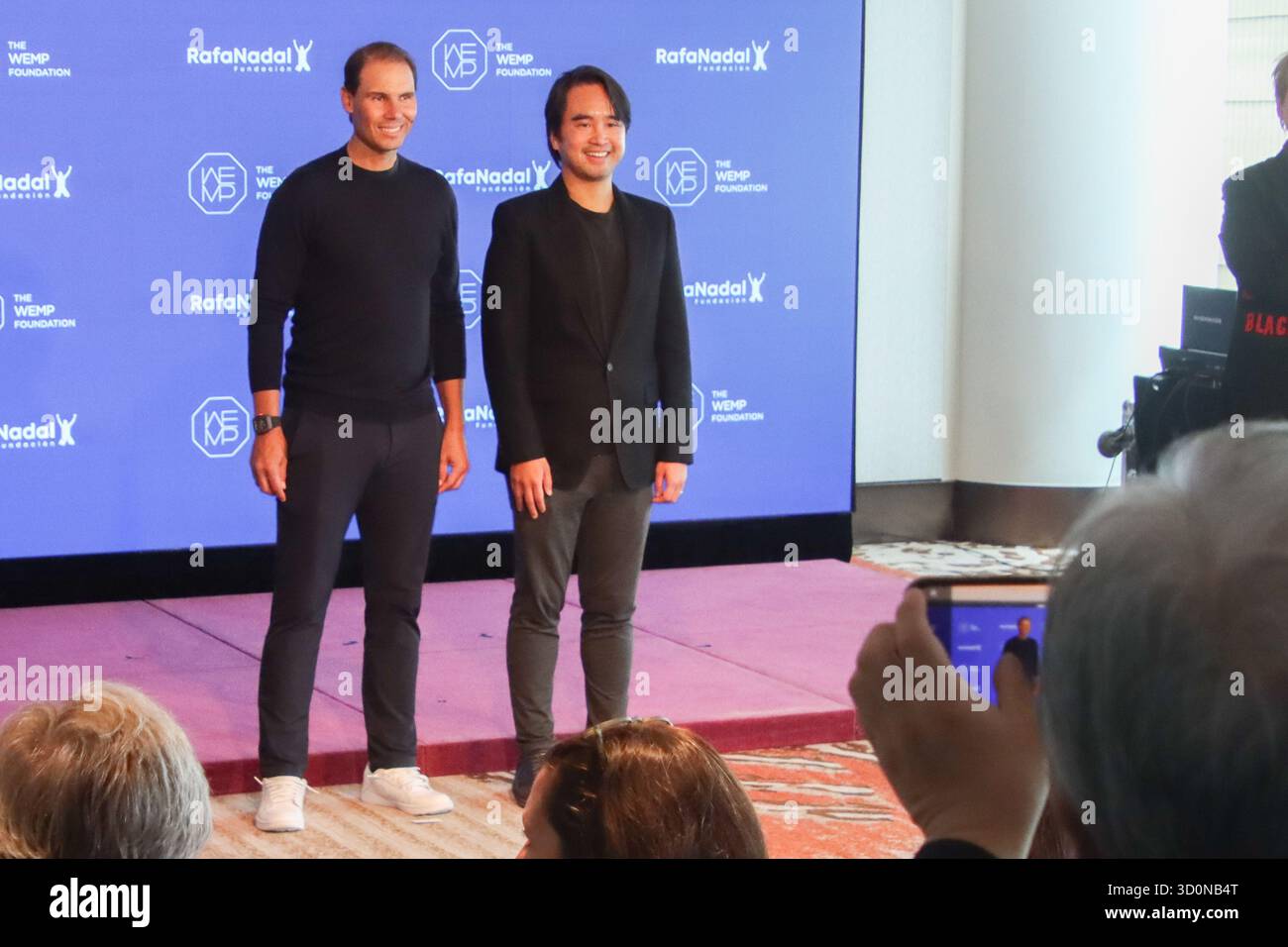 Rafael Nadal (L), founder of Fundacion Rafa Nadal and Adrian Cheung (R ...