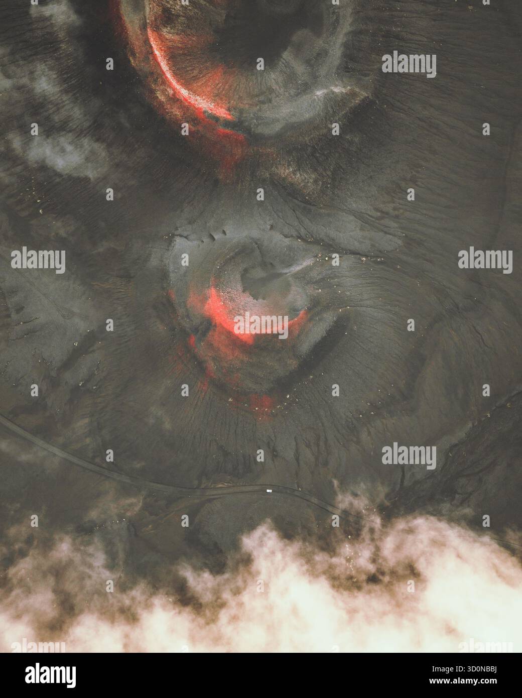 Aerial view of a volcanic landscape where plumes of red-hot lava ...