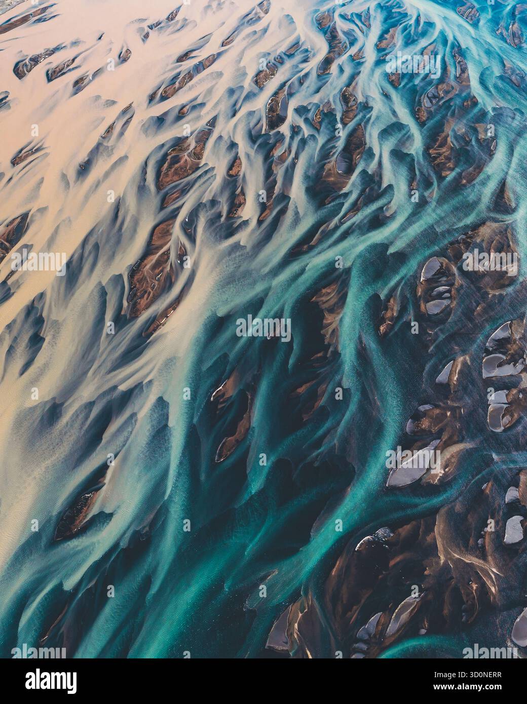 Aerial view of glacial rivers carve paths through the landscape ...