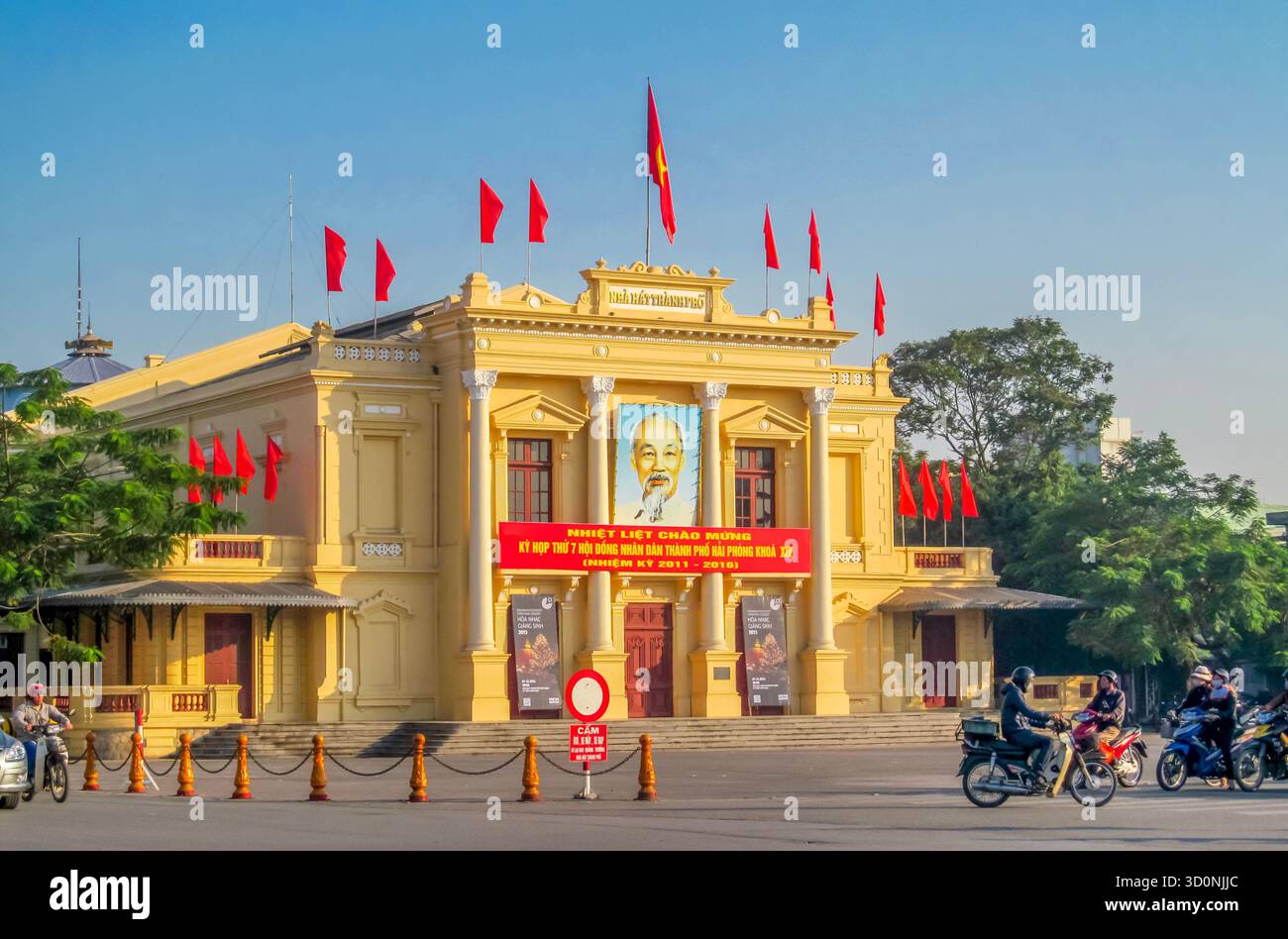 Communist propaganda red billboards united along a Vietnamese street ...