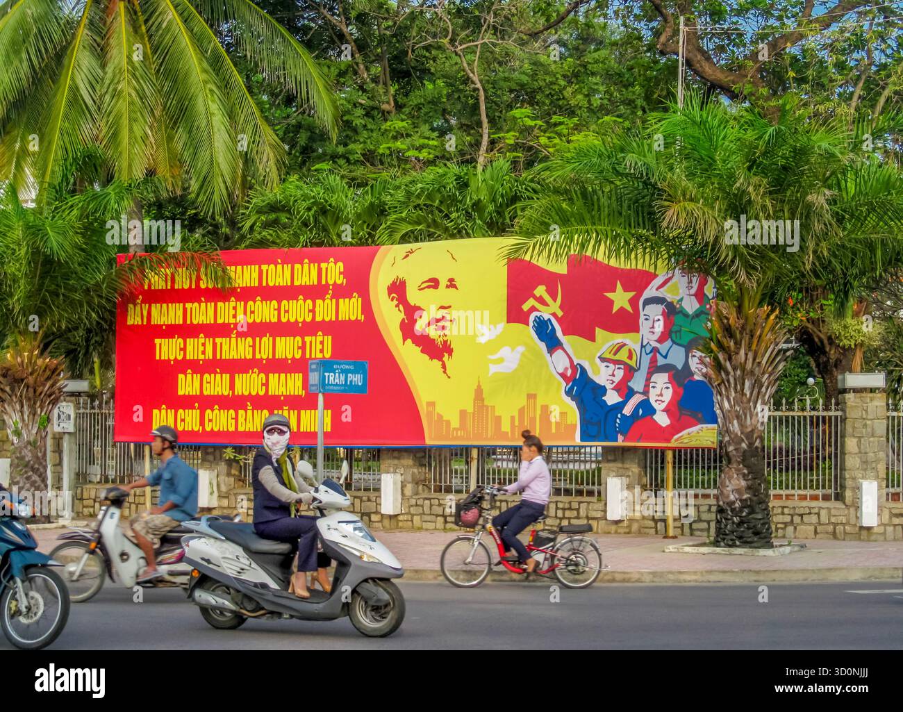 Communist propaganda red billboards united along a Vietnamese street ...