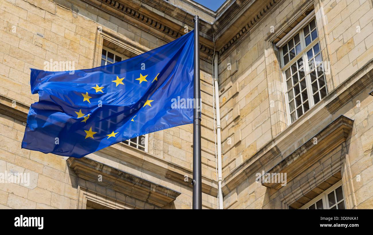 Waving flag of the European union in front of the city hall of Rouen in ...