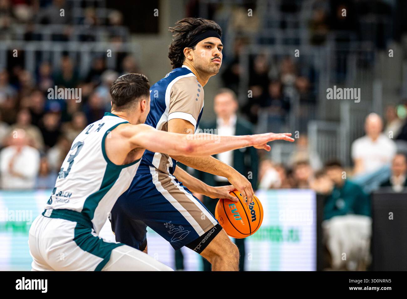 Erol Ersek (11; MLP Academics Heidelberg) controls the ball while being ...