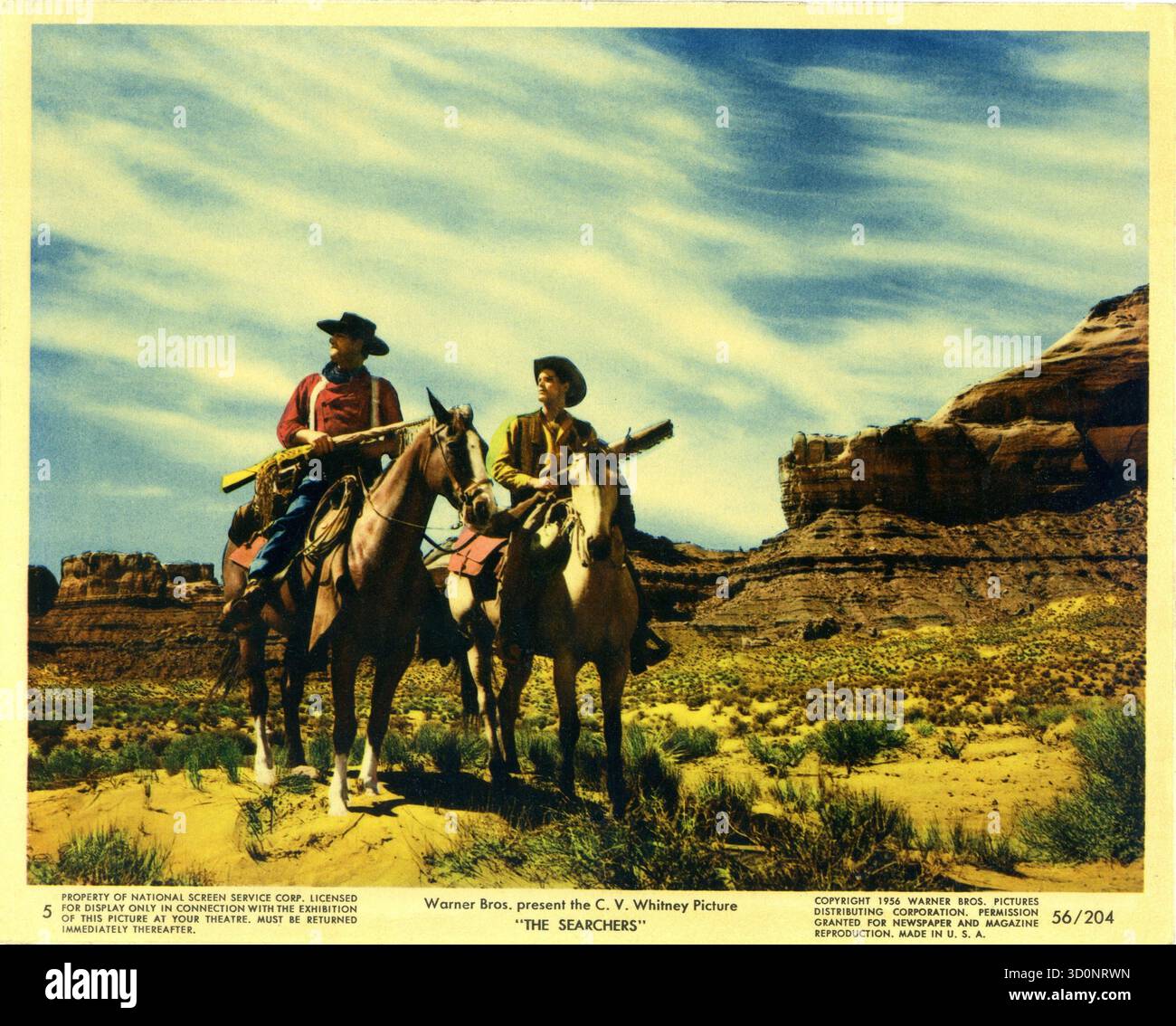 JOHN WAYNE and JEFFREY HUNTER in a scene from THE SEARCHERS 1956 ...