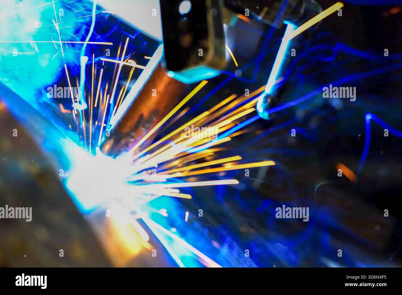 Pipe welding. Welding works. Sparks of welding Stock Photo - Alamy