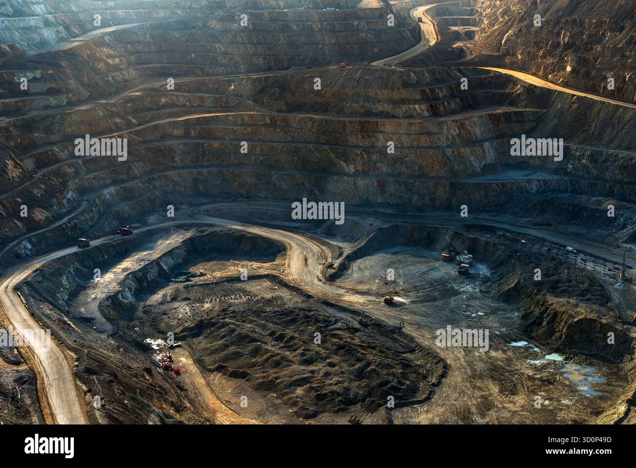 The immense scale of a copper mine in Chile, with roads winding down ...
