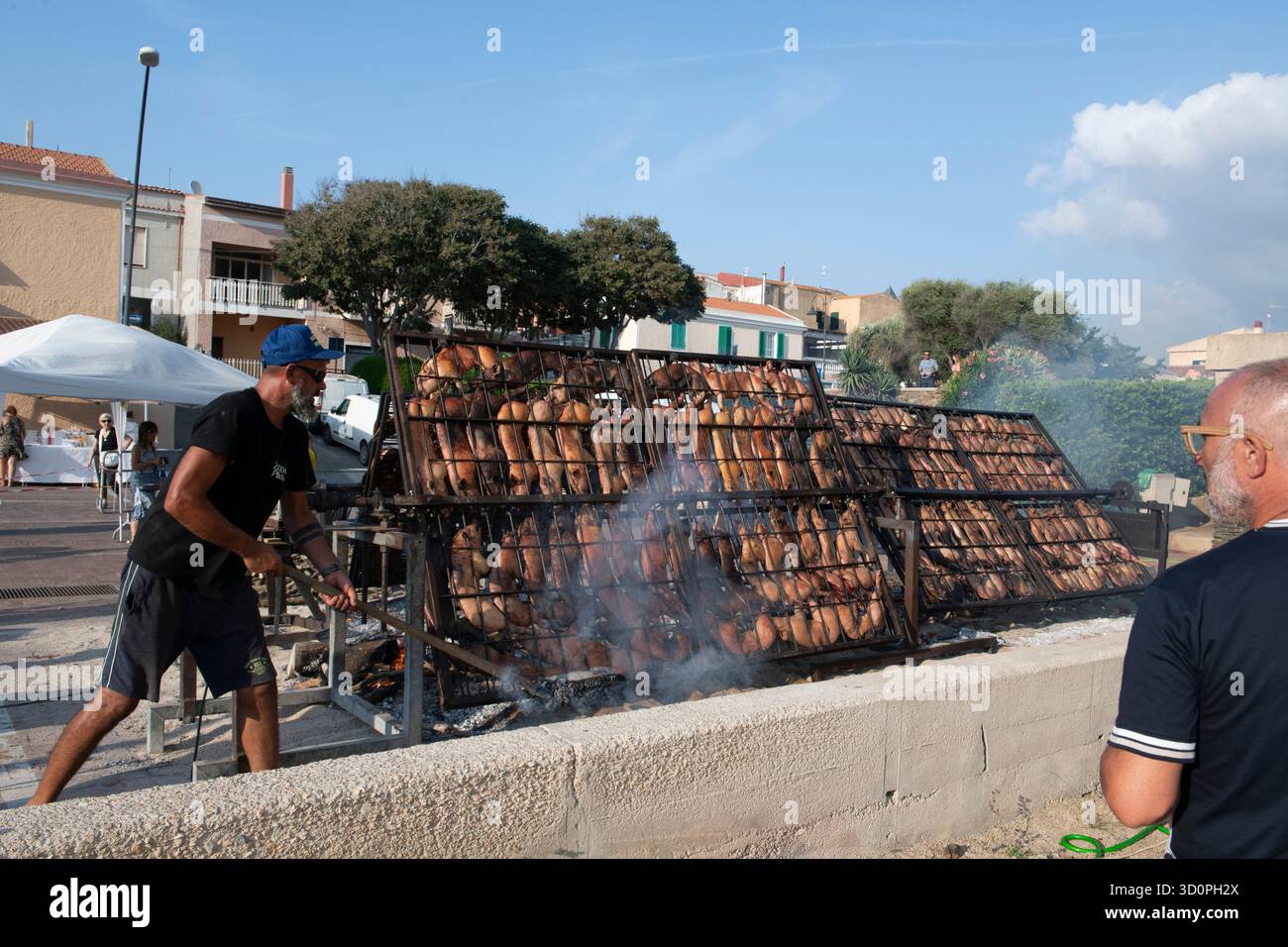 Sardinia, Italy, Sassari, Stintino, August 20, 2025 - Whole pig spit ...
