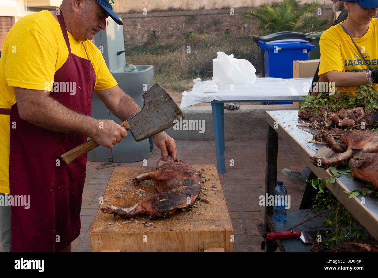 Sardinia, Italy, Sassari, Stintino, August 20, 2025 - Whole pig spit ...