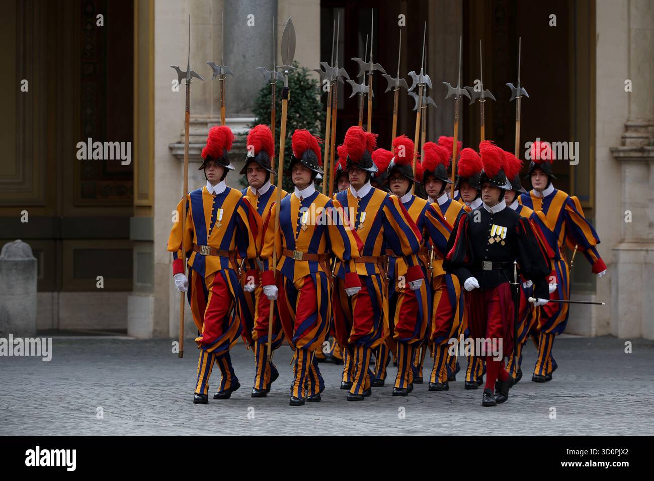 The Swiss Guards line up for the arrival of the royals in the courtyard ...