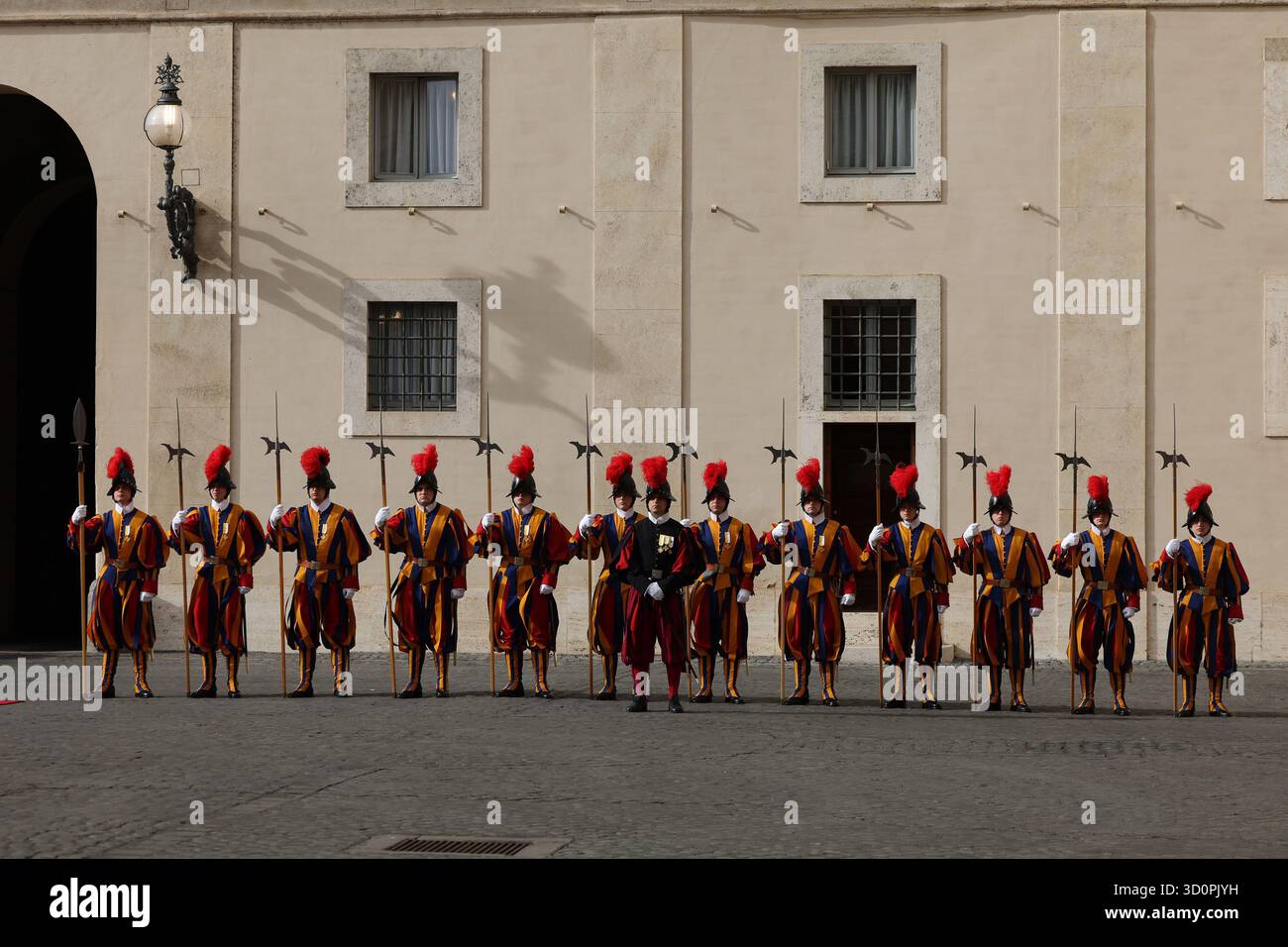 The Swiss Guards line up for the arrival of the royals in the courtyard ...