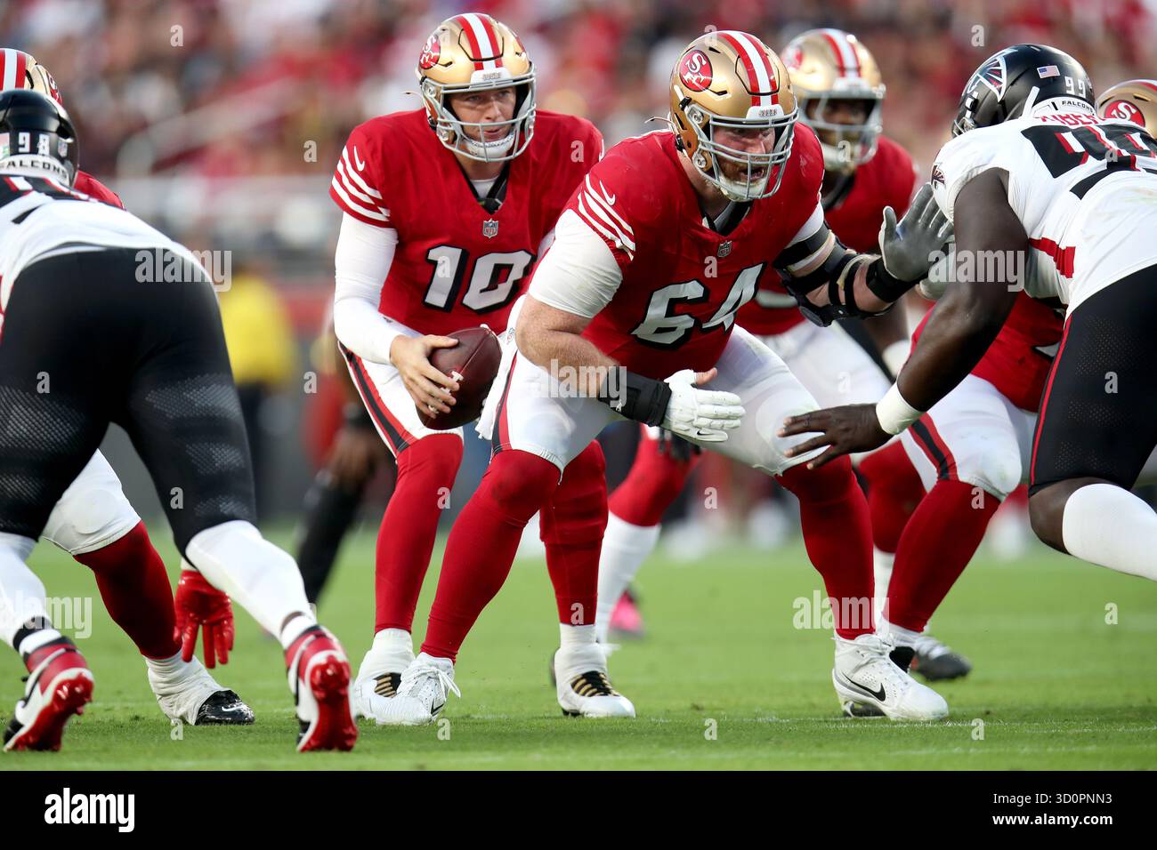 San Francisco 49ers quarterback Mac Jones (10) receives the ball from ...