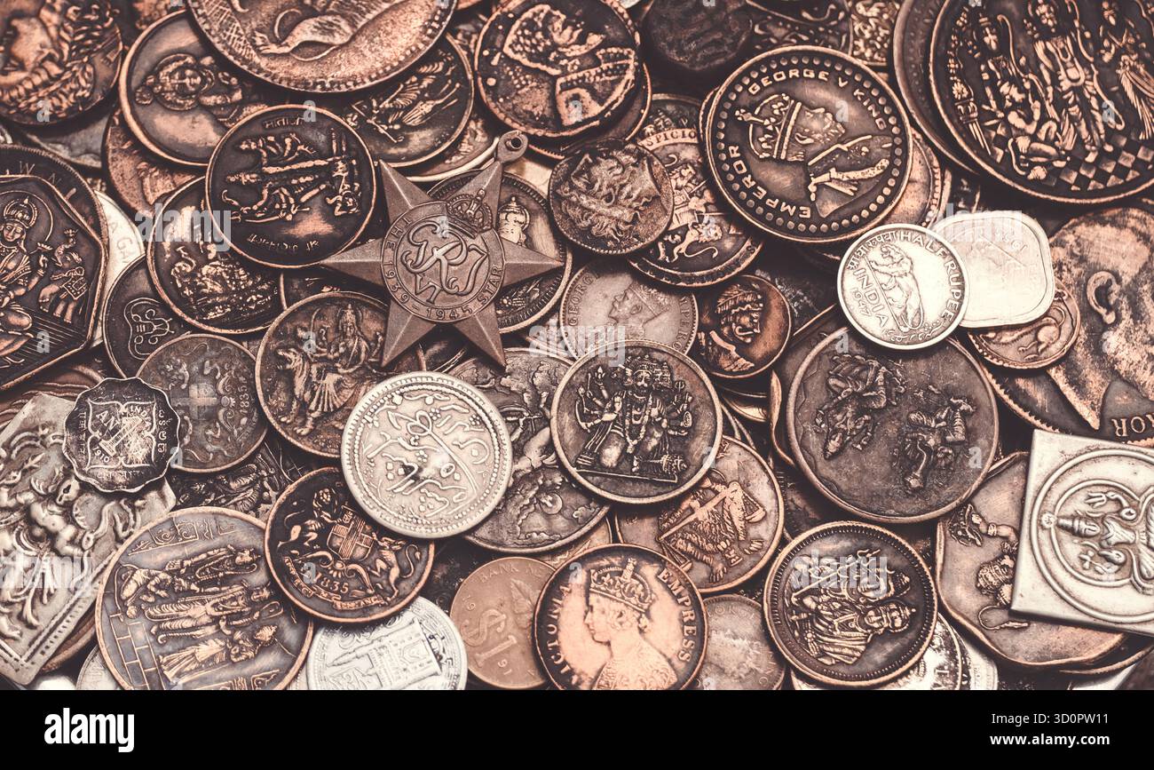 A collection of old coins from India, Russia, and the British Raj era ...