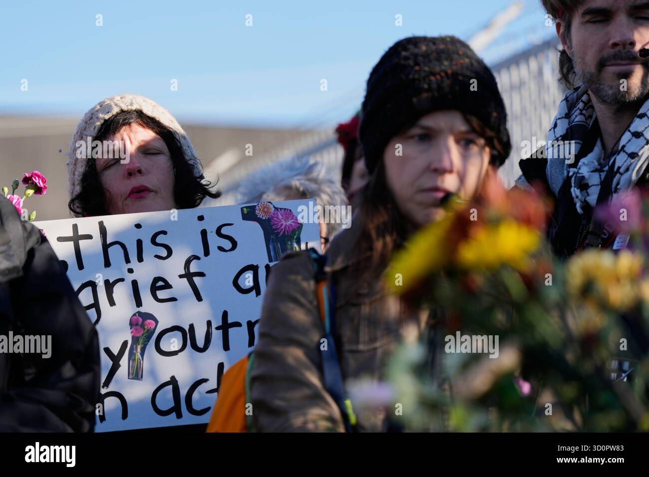 Protesters pray as they gather outside an ICE processing facility in ...
