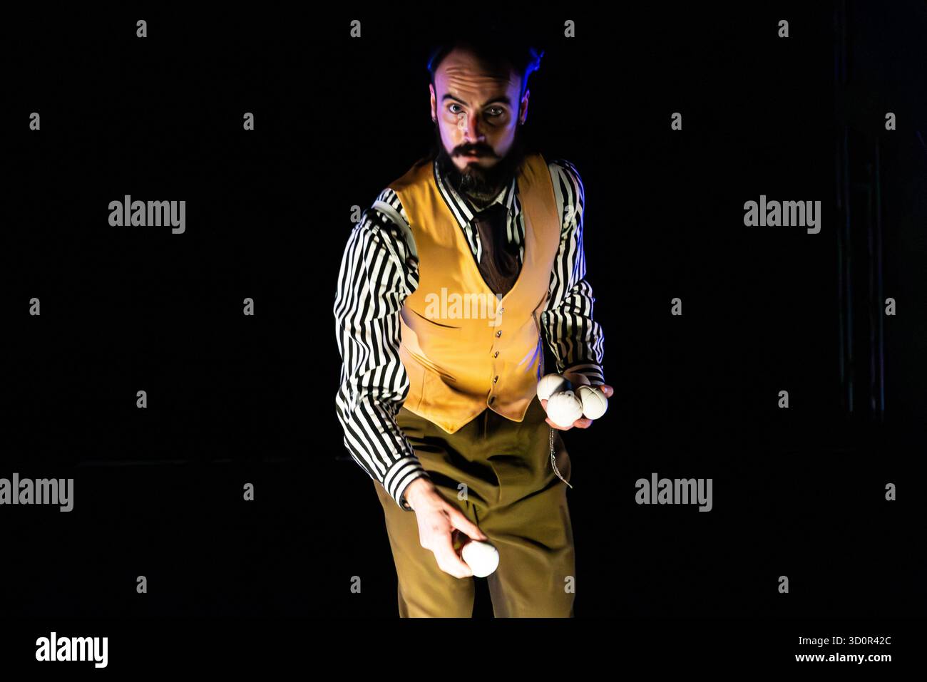 Circus artist Robert Gallagher-Lyall performing a comical juggling work ...