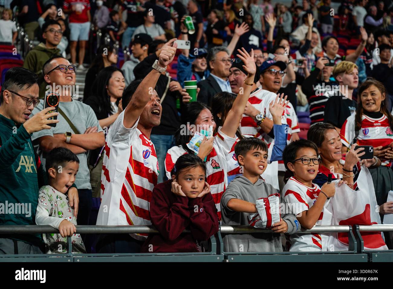 Japan rugby team fans on the stands after a rugby game at Kai Tak Main ...